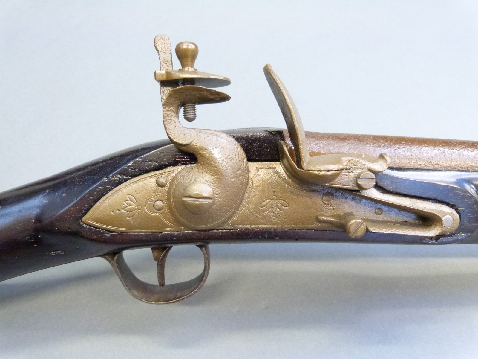 Flintlock hammer action musket with engraved Roman type lock, engraved ...