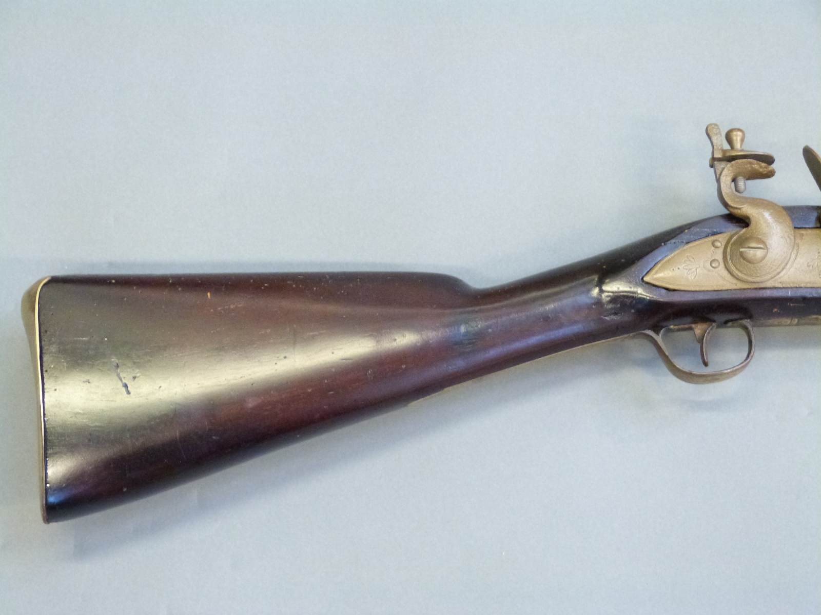 Flintlock hammer action musket with engraved Roman type lock, engraved ...