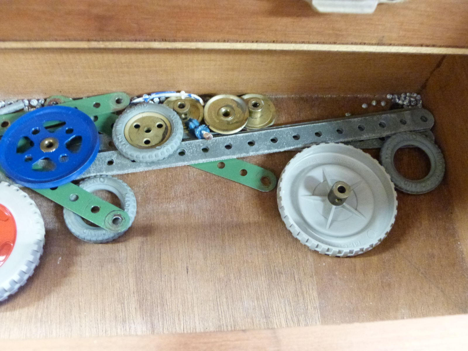 A collection of loose Meccano parts with instructions for outfits 1, 2/ ...