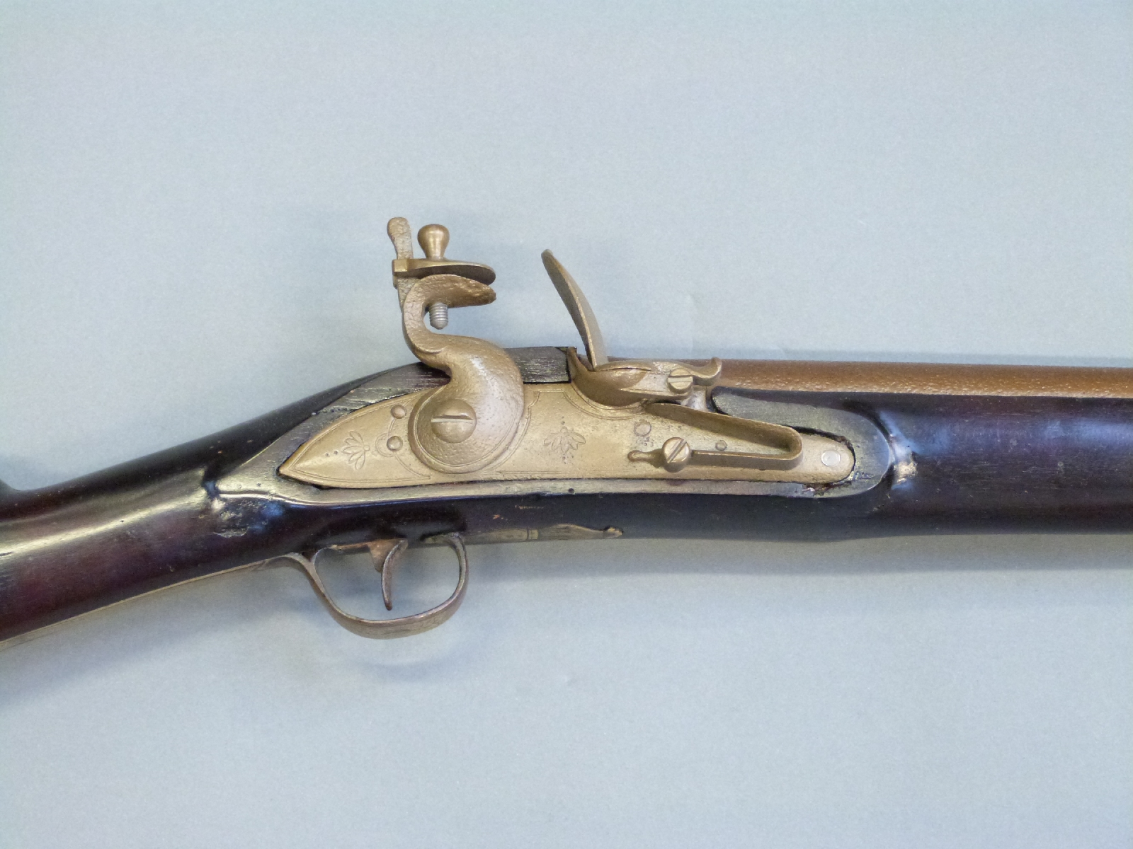 Flintlock hammer action musket with engraved Roman type lock, engraved ...