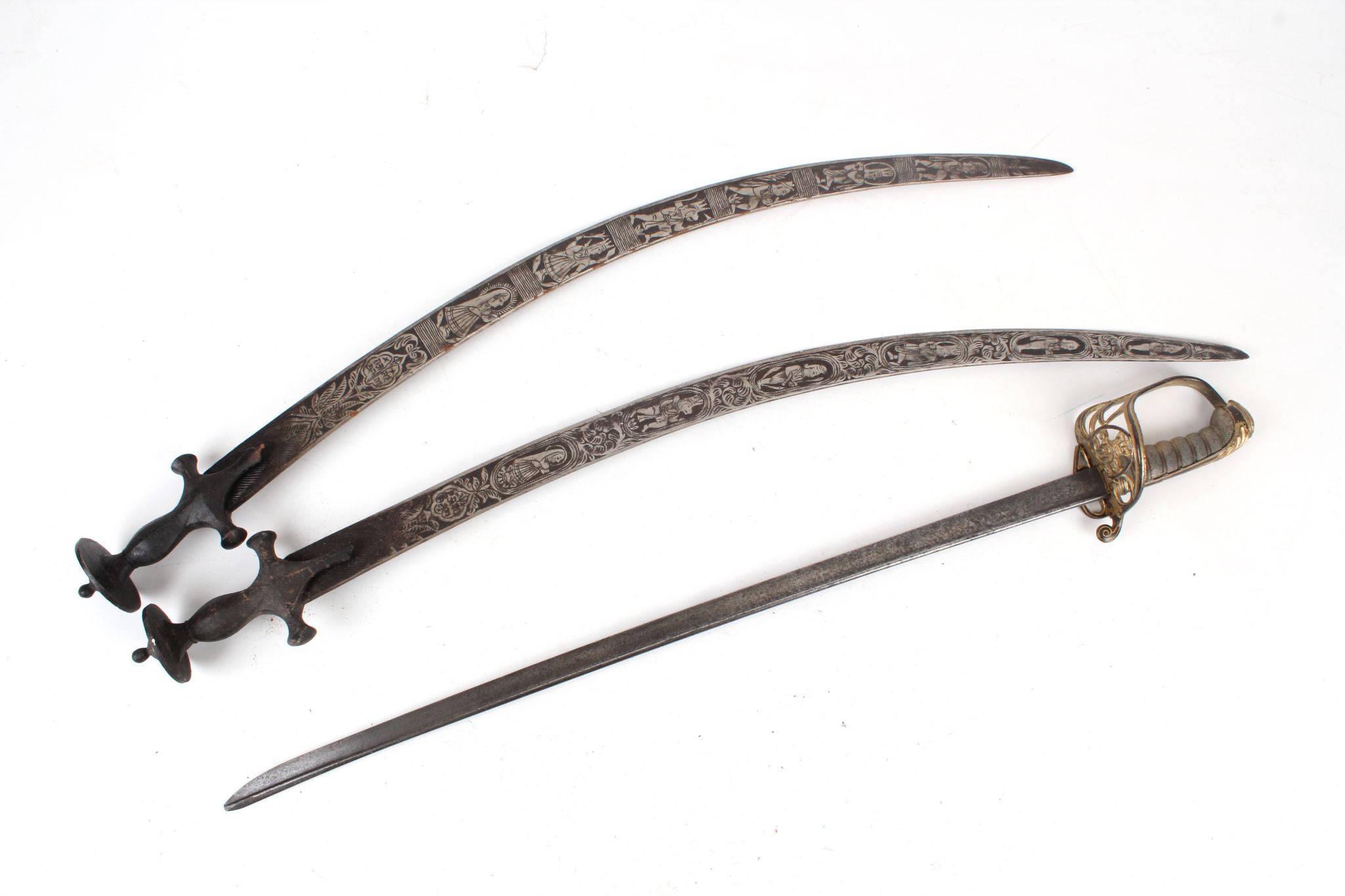 Two Indian Talwar swords, 69.5cm, decorated blades, circa 1940s, a ...