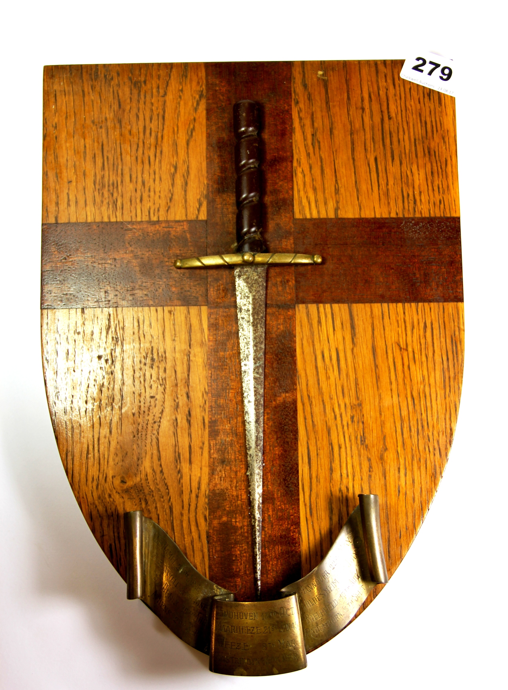 An interesting oak shield wall plaque, mounted with a dagger and ...