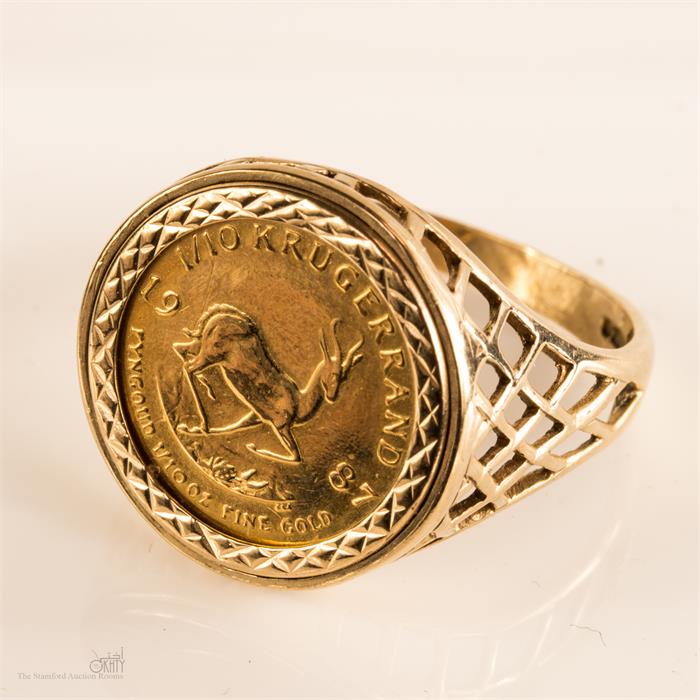 A 1987 1/10 Krugerrand mounted in a 9ct gold ring setting, size U/V, 7g.