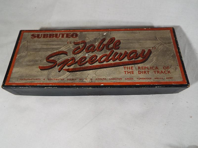A Subbuteo 'Table Speedway' boxed set with four cardboard riders, two ...