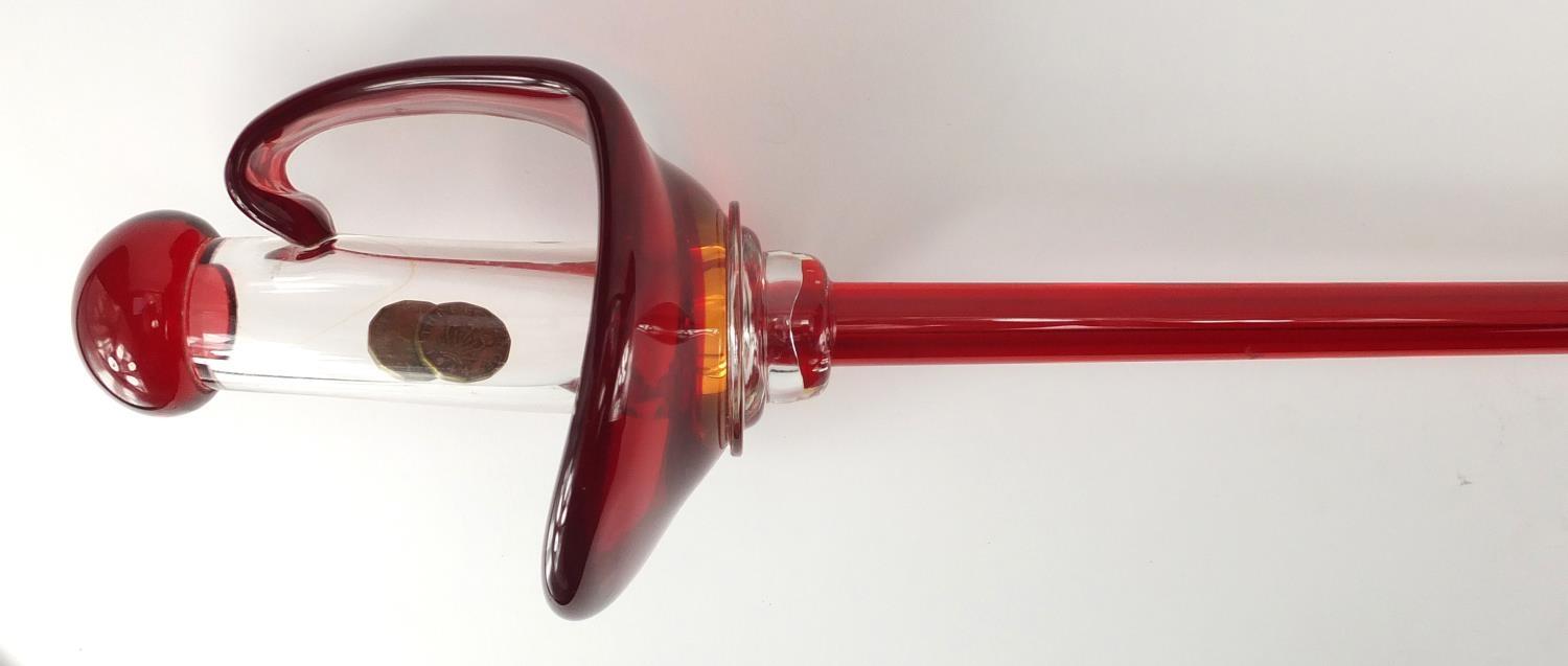 Whitefriars ruby sword with clear hilt, inset with two three penny ...