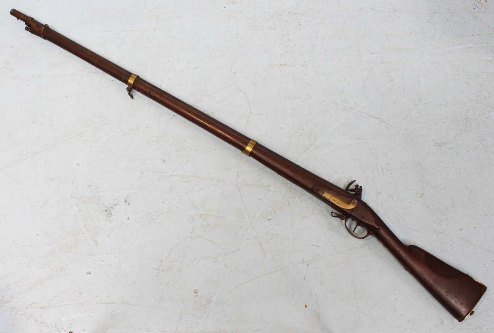 A French pattern 'Charleville' musket, three brass ring 45-inch barrel ...