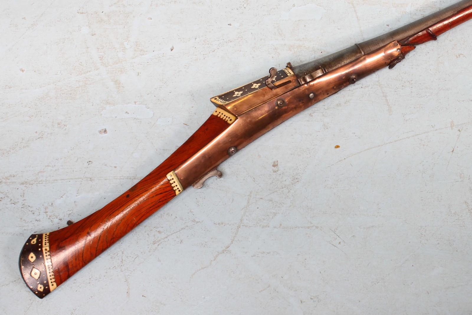 An Indian 'Toradar' matchlock musket, with 50" steel barrel with flared ...