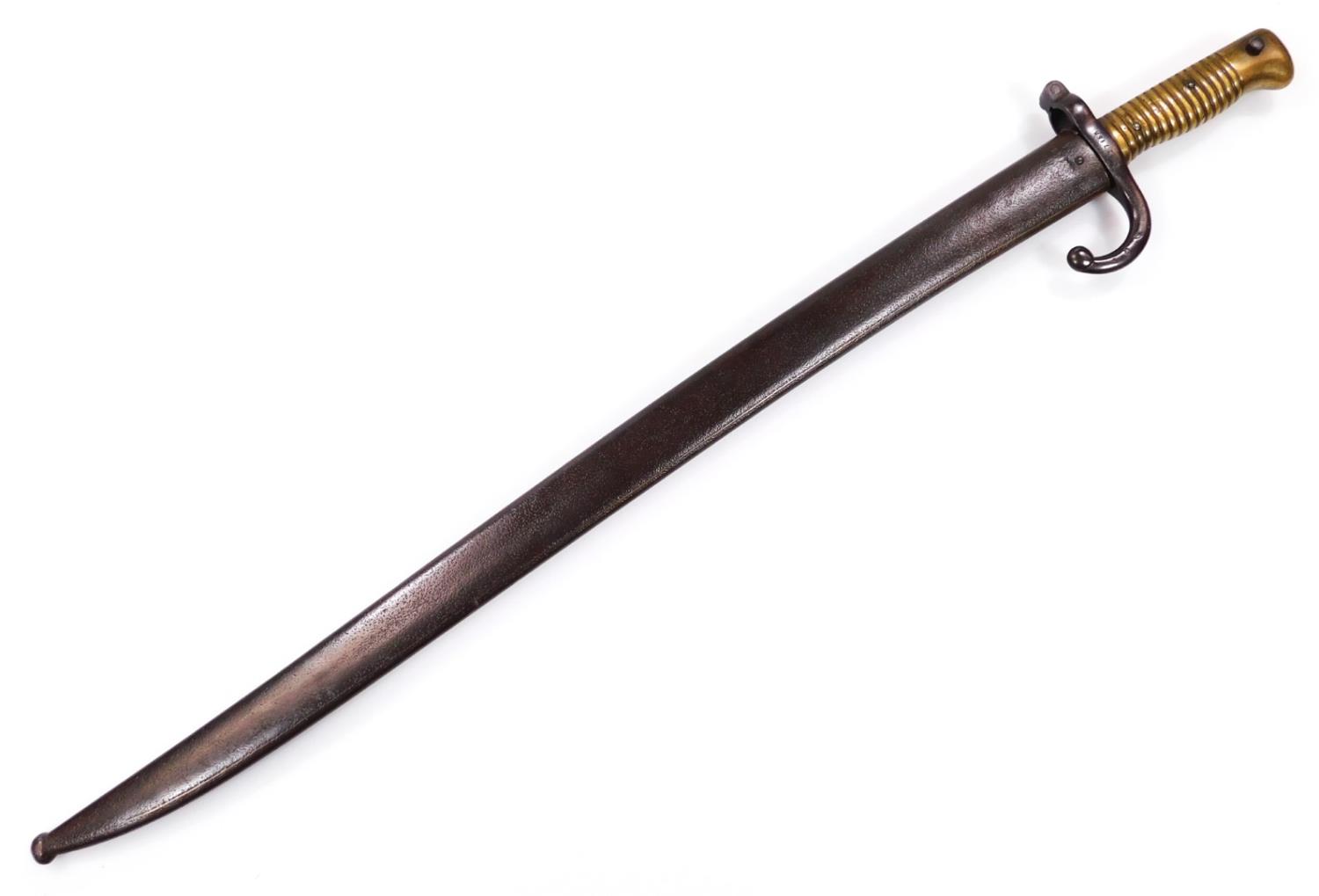 An 1869 pattern bayonet, with turned brass handle, shaped named blade ...