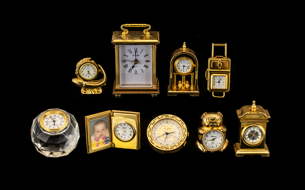 A Good Collection of Gold Gilt and Brass Miniature Clocks. Nine in ...