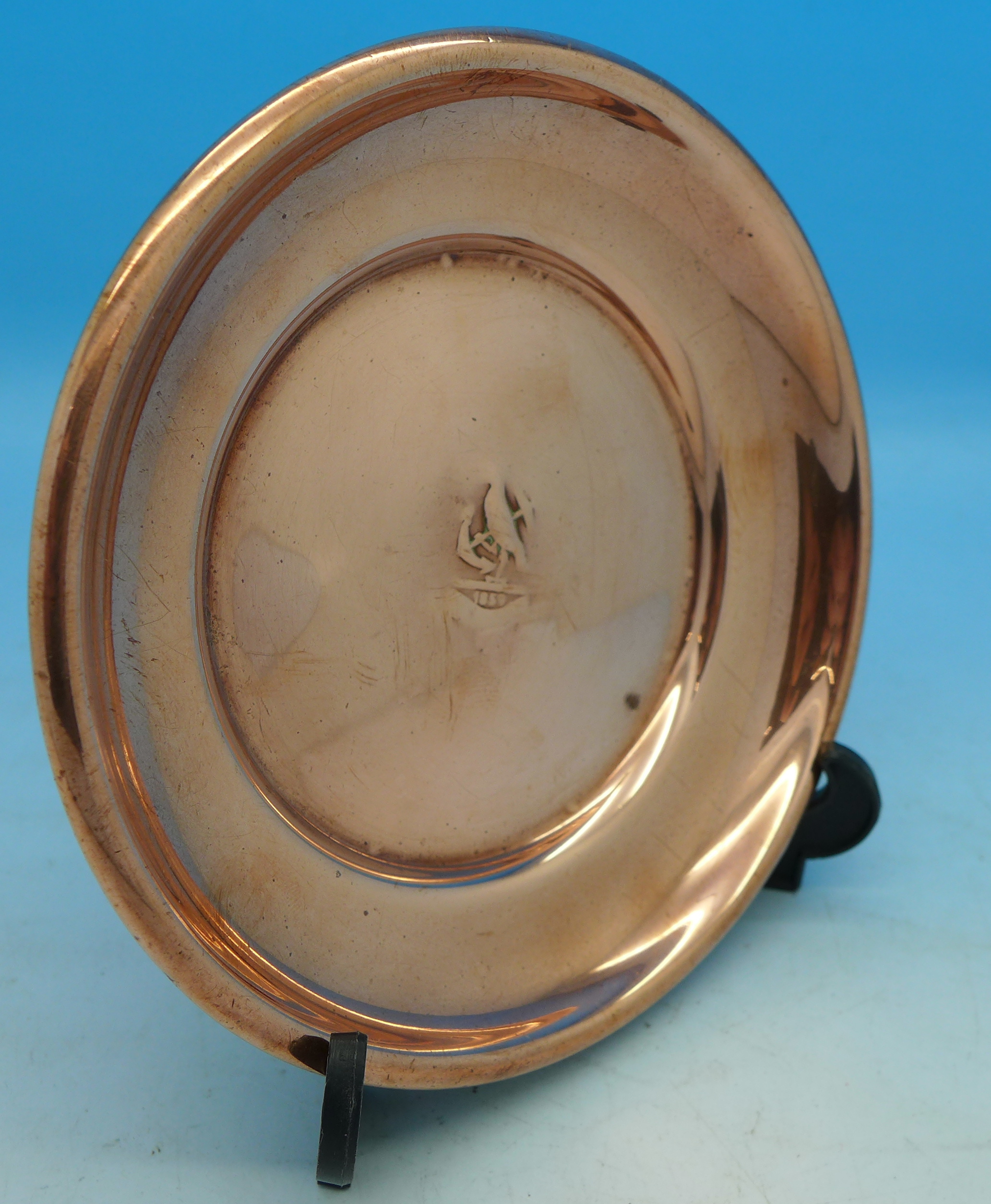 A small copper tray with emblem of HMS Hood with anchor, commemorates ...