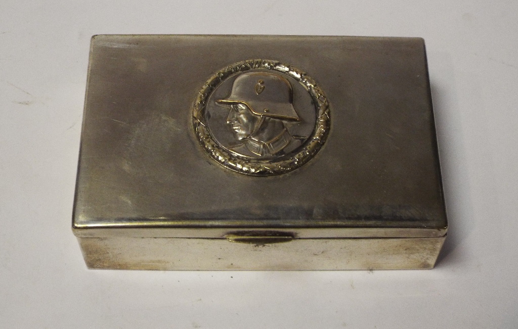 A German World War II era plated cigarette box, the top decorated a ...