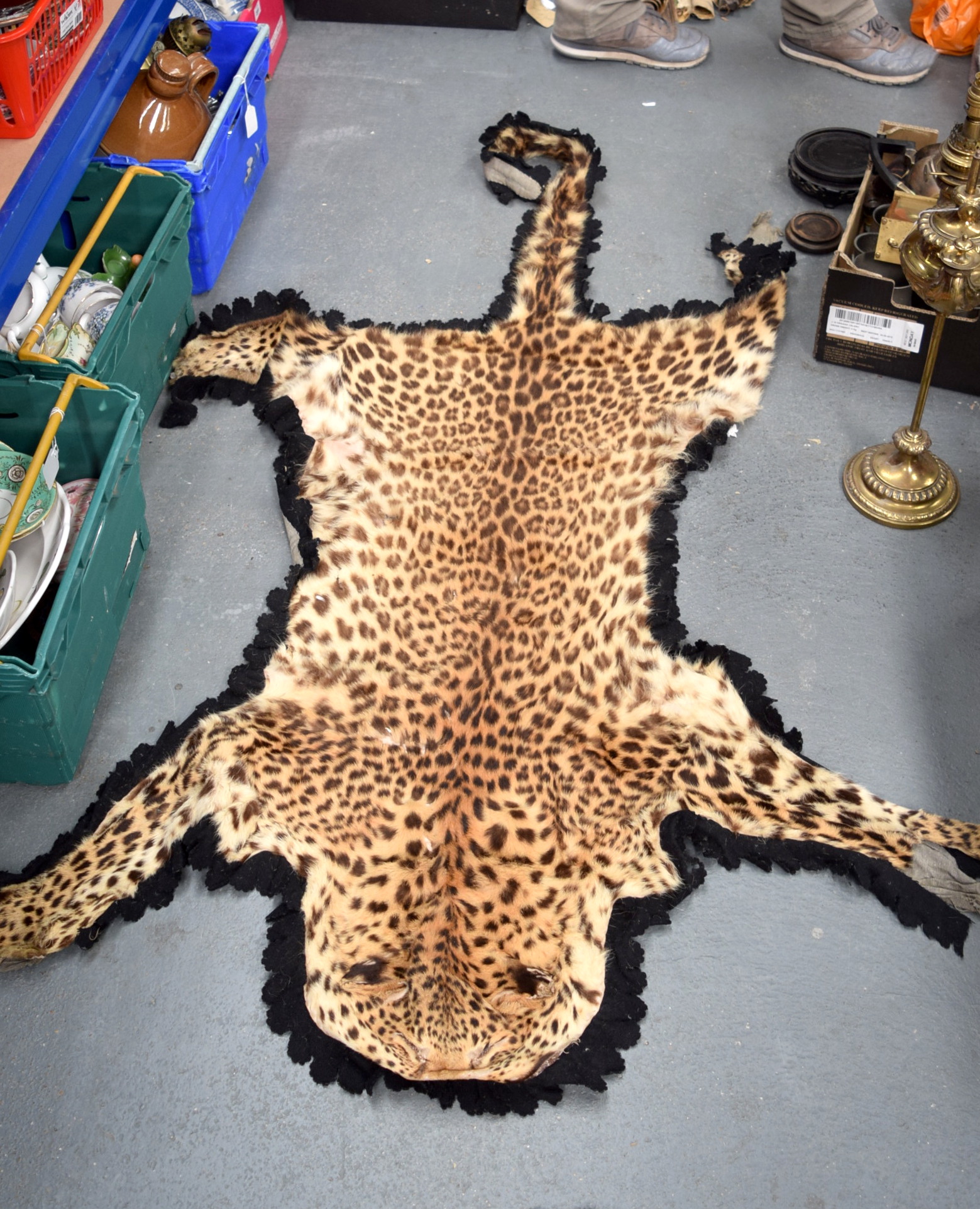 TWO ANTIQUE LEOPARD SKIN FUR RUGS, together with a jacket. Largest 185 ...