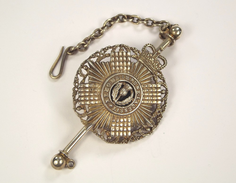 PIPER'S SILVER KILT PIN. A Royal Scots Dragoon Guards silver piper's ...