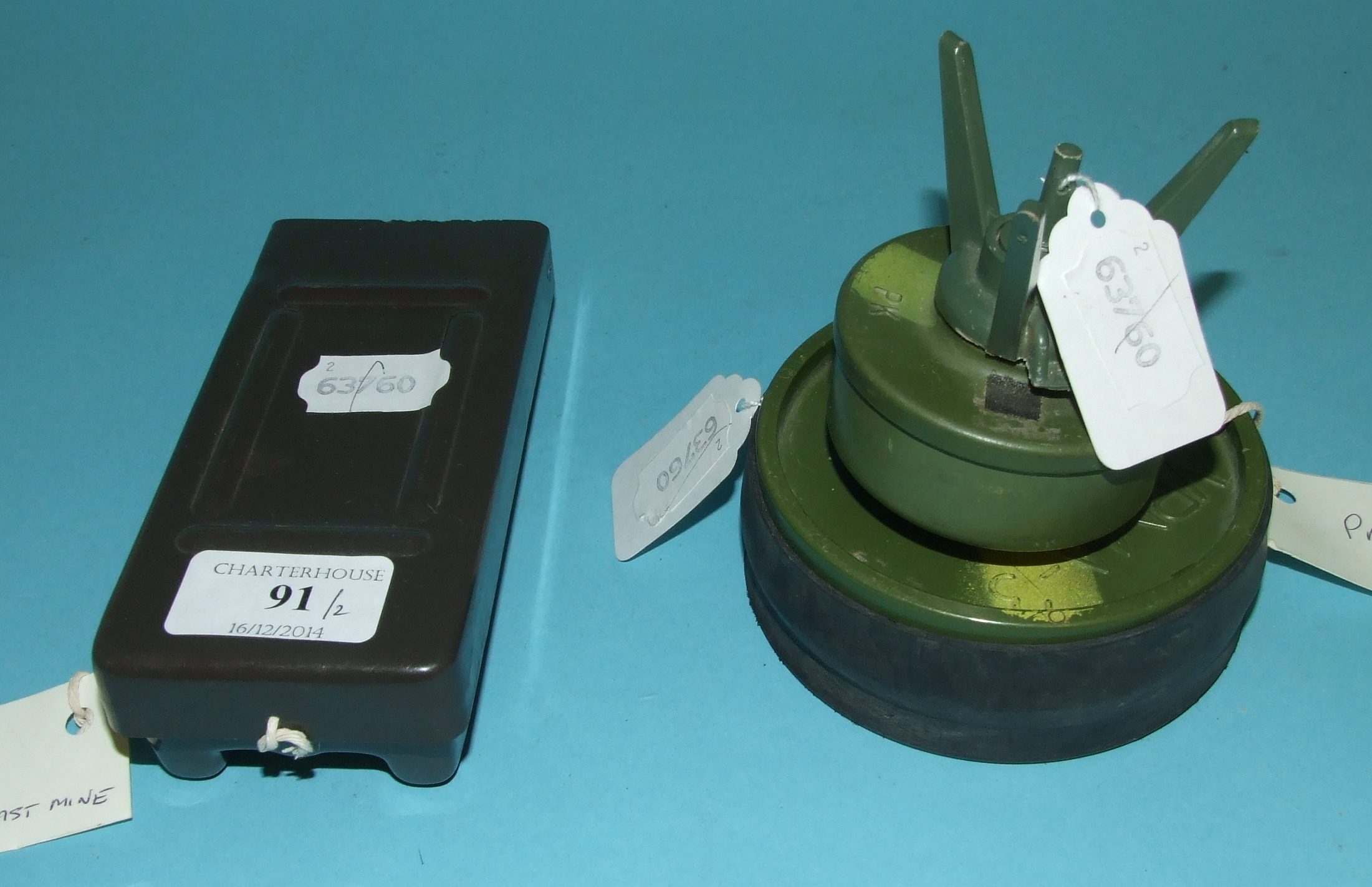 A Yugoslavian anti-personnel blast mine, PMA-2, and two others, PMA-1 ...