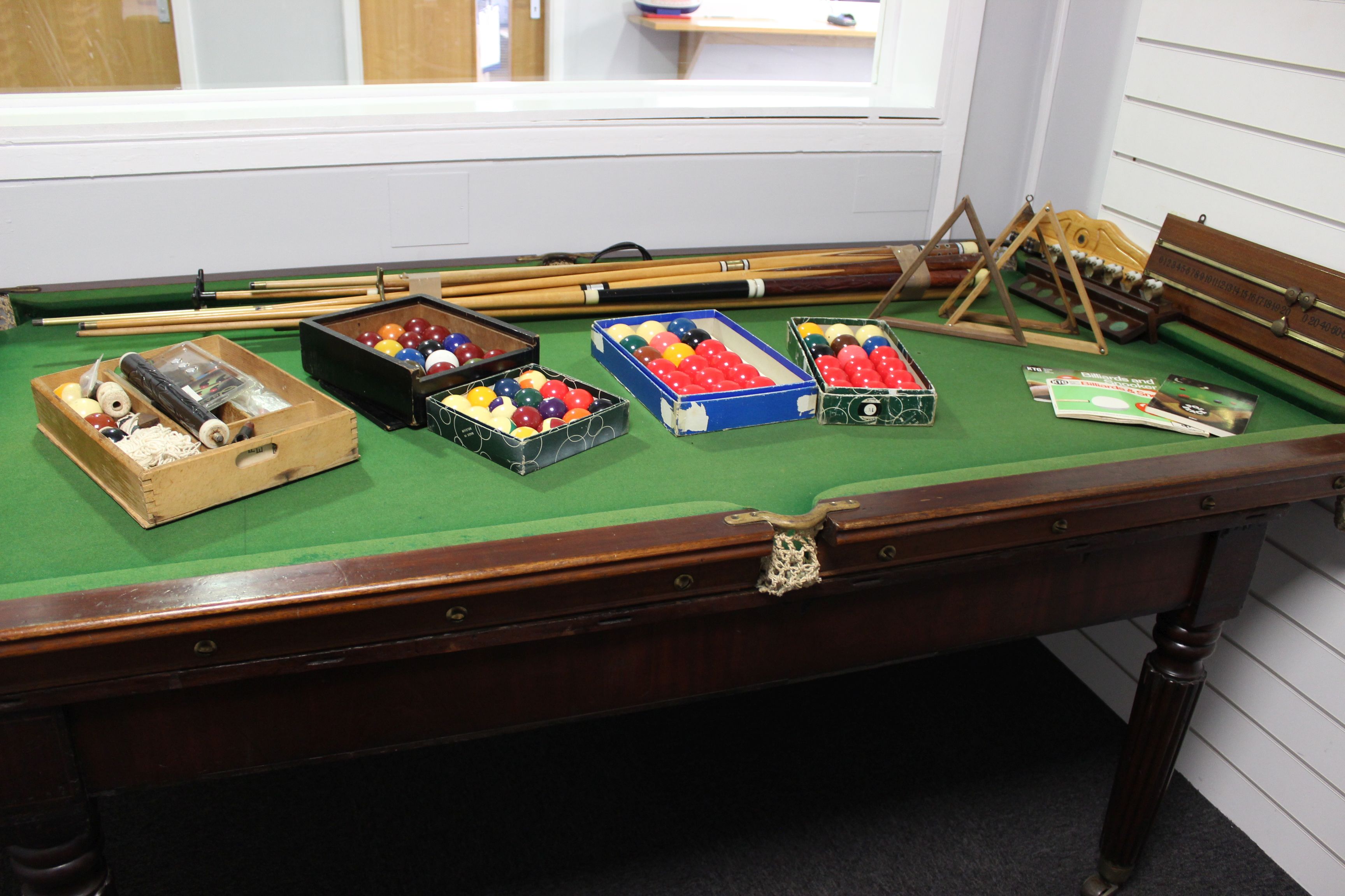 An early 20th century mahogany half size snooker table. Slate and felt ...