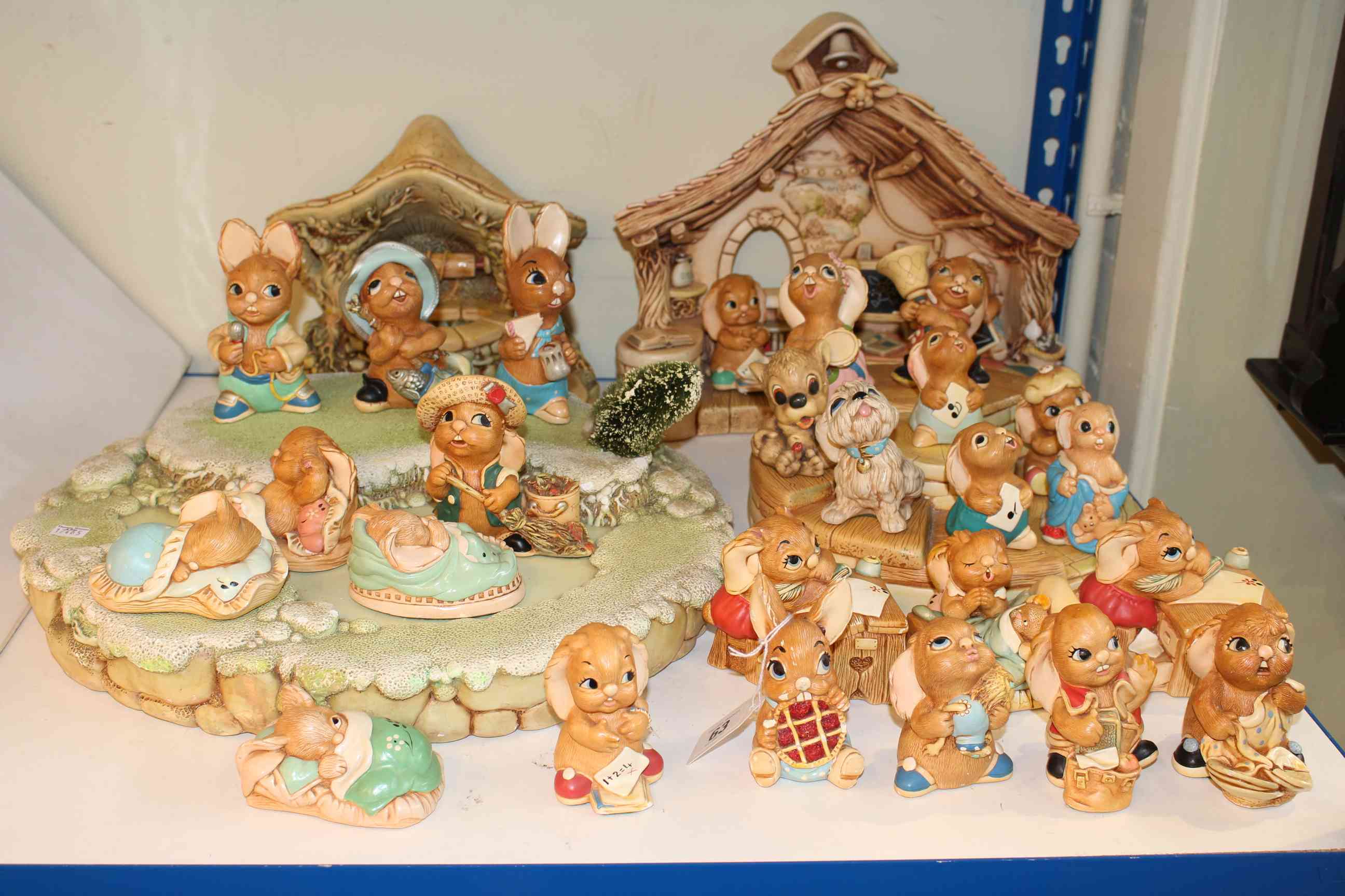 Collection of Pendelfin rabbits and stands