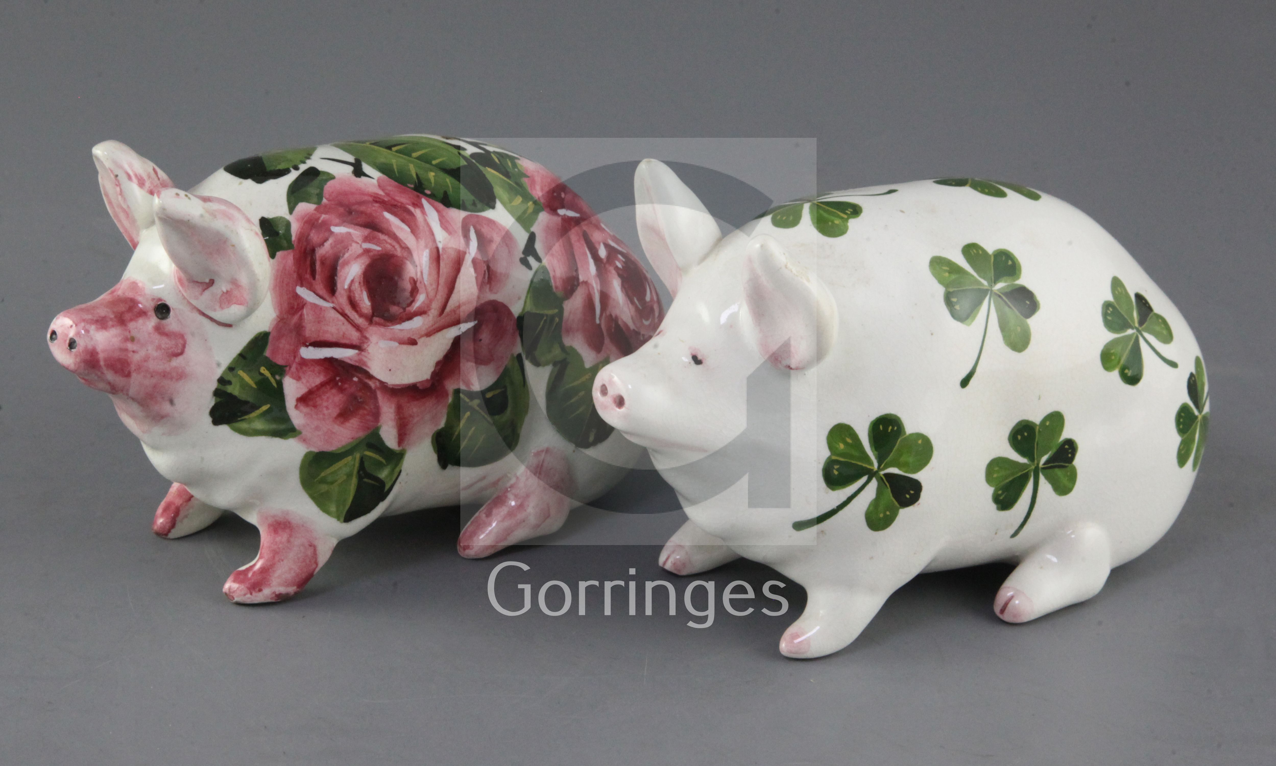 Two Wemyss models of pigs, early 20th century, the first decorated with ...