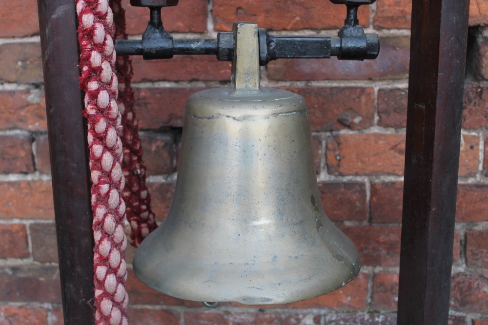 A LARGE CAST SHIPS BELL ON A WOODEN STAND, with striker, H 32 cm (Bell ...