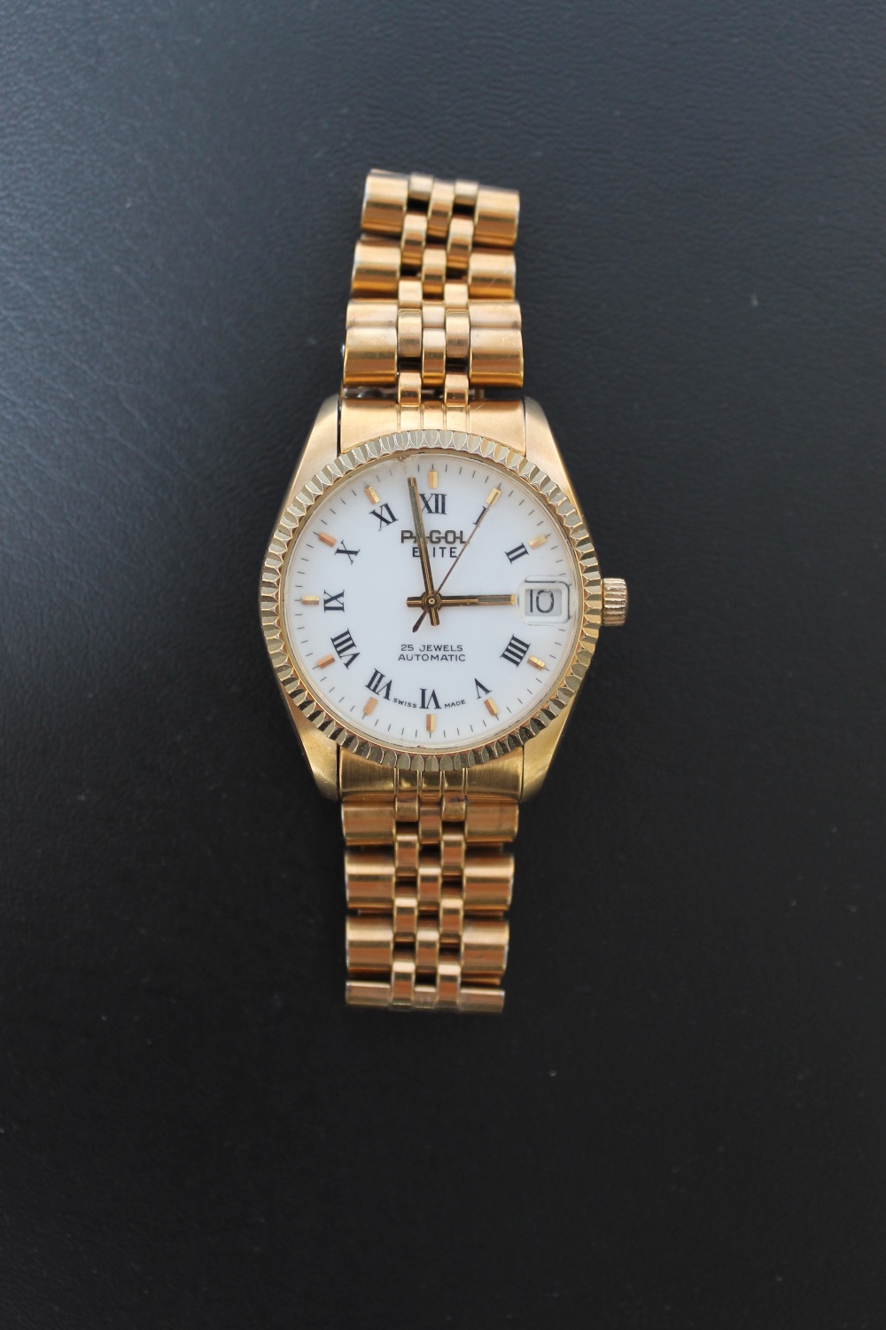 A GENTLEMAN'S GOLD PLATED 'PAGOL' ELITE AUTOMATIC DATE WRIST WATCH, on ...