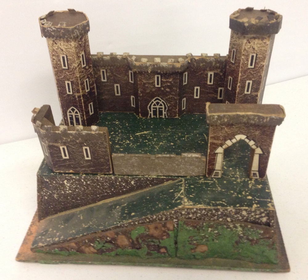 A vintage small wooden toy soldier fort/castle.