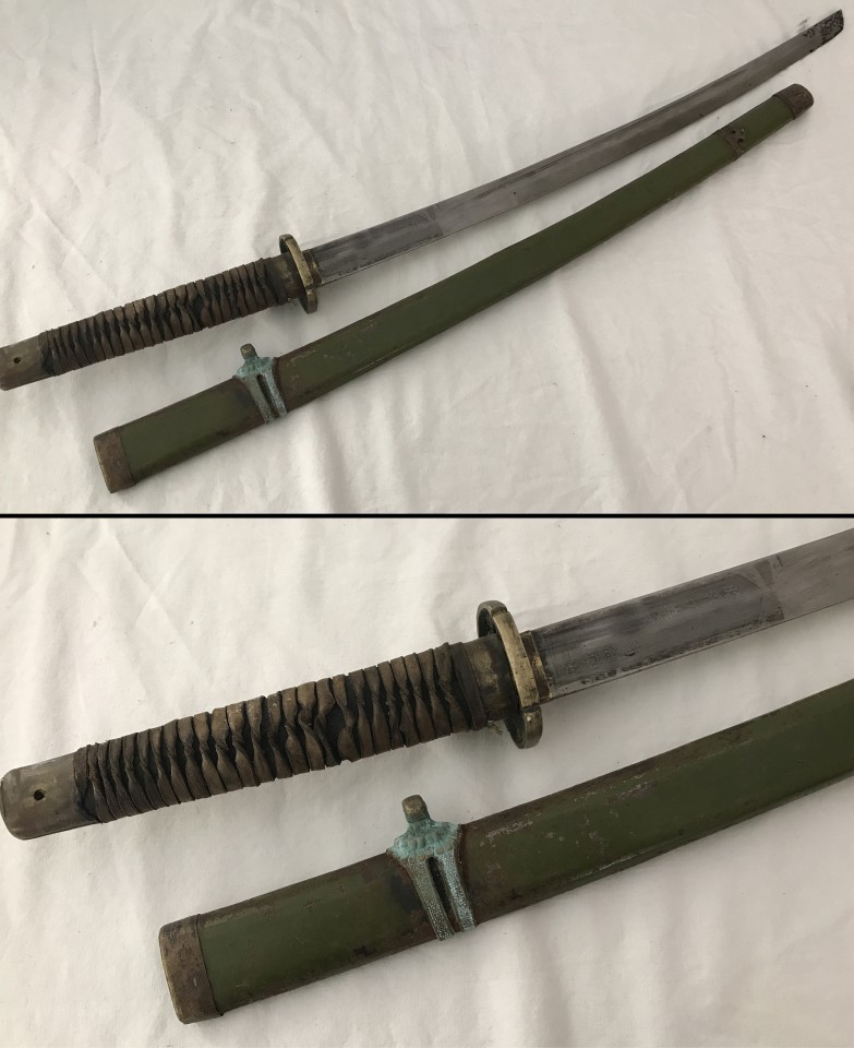 A WW2 Japanese Officers samurai sword with sheath. Japanese lettering ...