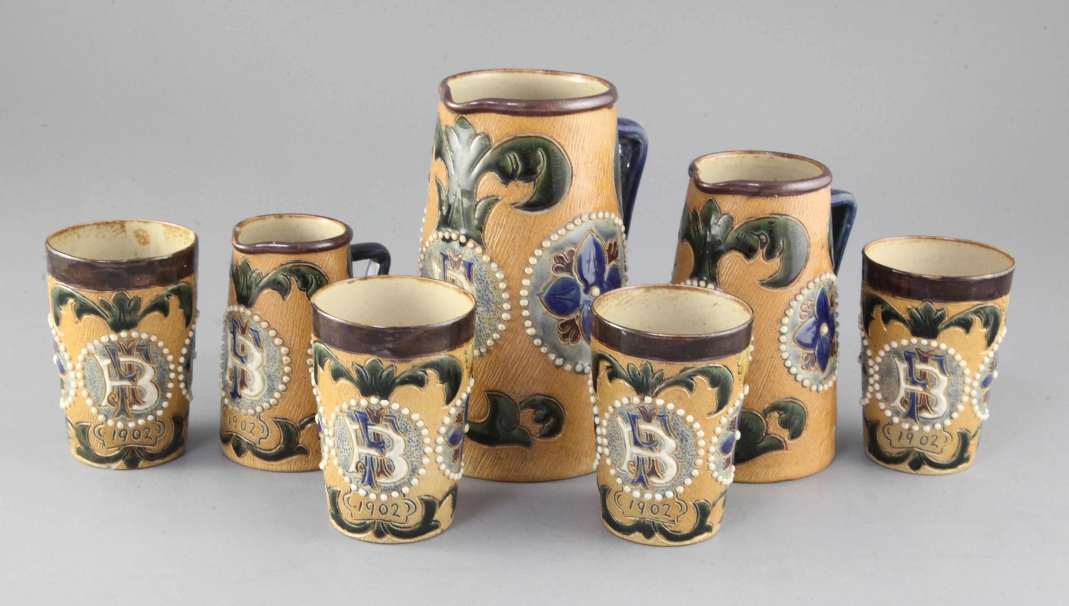 A collection of Fulham pottery stoneware vessels, c.1902, comprising ...