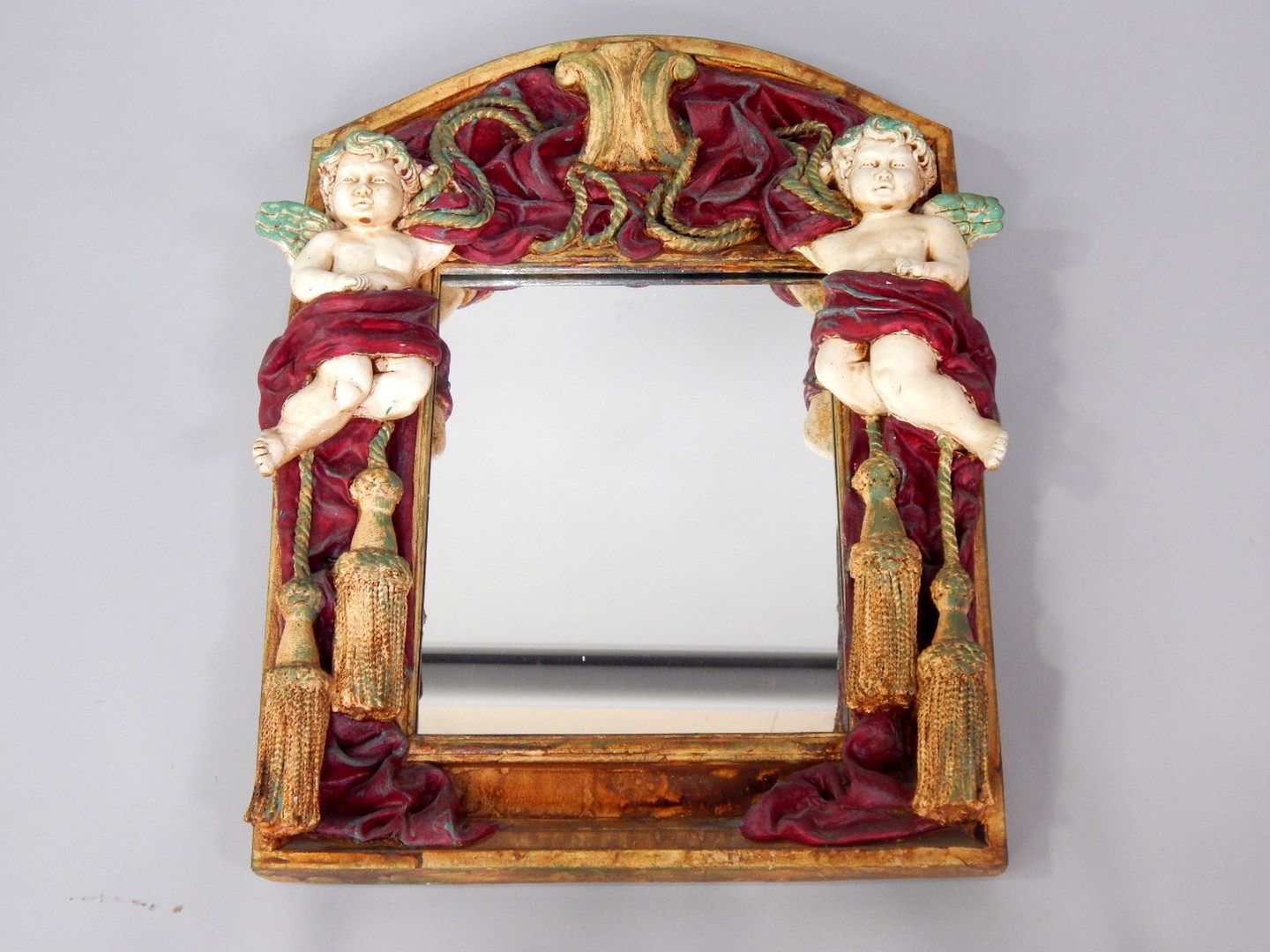 A Renaissance style wall mirror by Alan Wallis Designs, the moulded ...