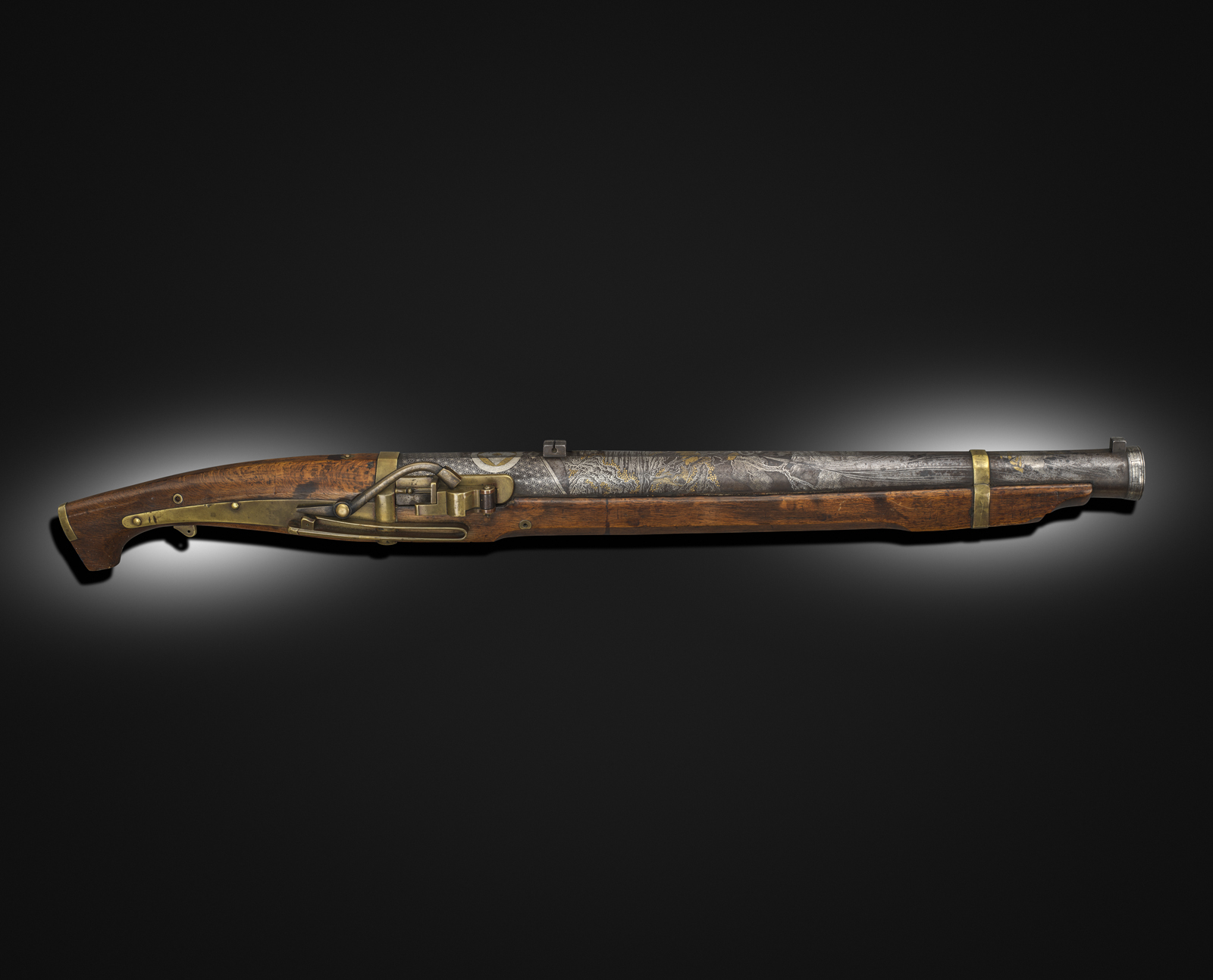 A FINE JAPANESE TAZUKE-RYU SCHOOL INLAID MATCHLOCK CARBINE, OZUTSU ...