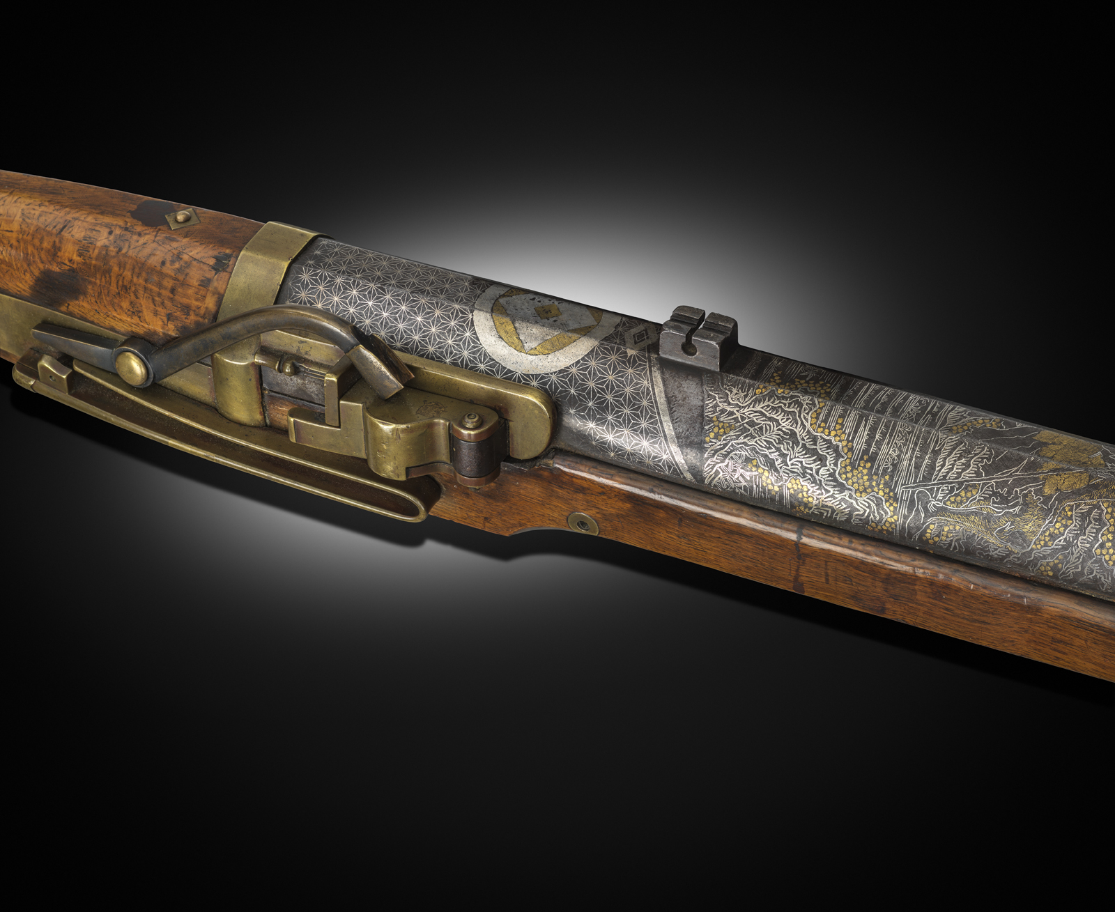 A FINE JAPANESE TAZUKE-RYU SCHOOL INLAID MATCHLOCK CARBINE, OZUTSU ...
