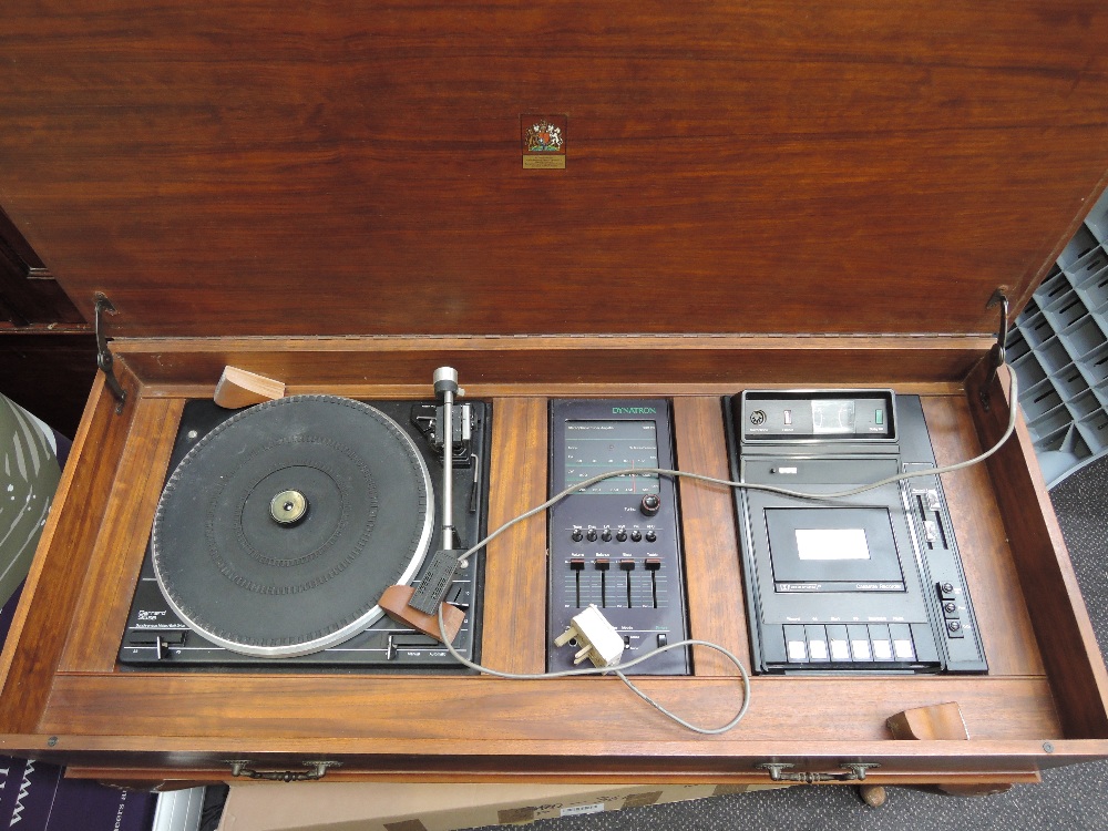 A vintage Dynatron radiogram in cherry style case on cabriole legs,