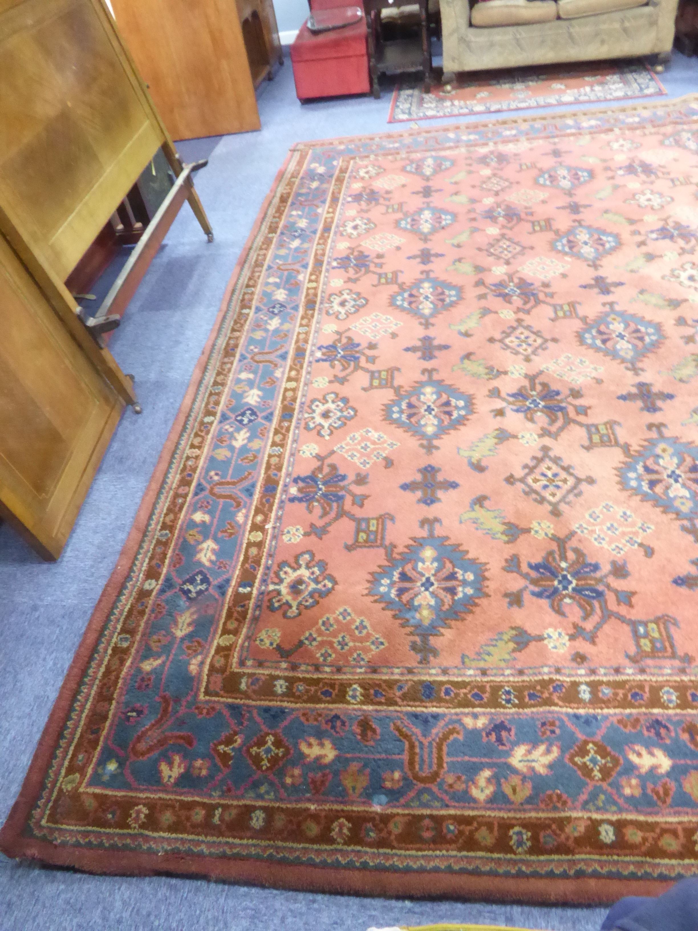 AN AXMINSTER DEEP WOOL PILE TURKEY PATTERN CARPET WITH DEEP ROSE GROUND ...