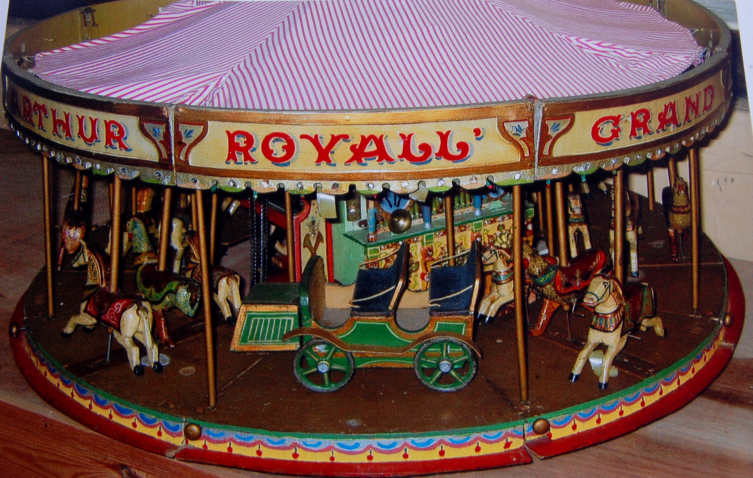 An early 20th century scale model of a fairground carousel, of wooden ...