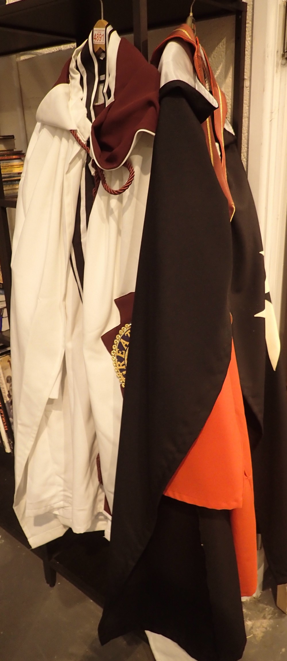 Two sets of Masonic robes capes and jewels one with wire embroidered badge