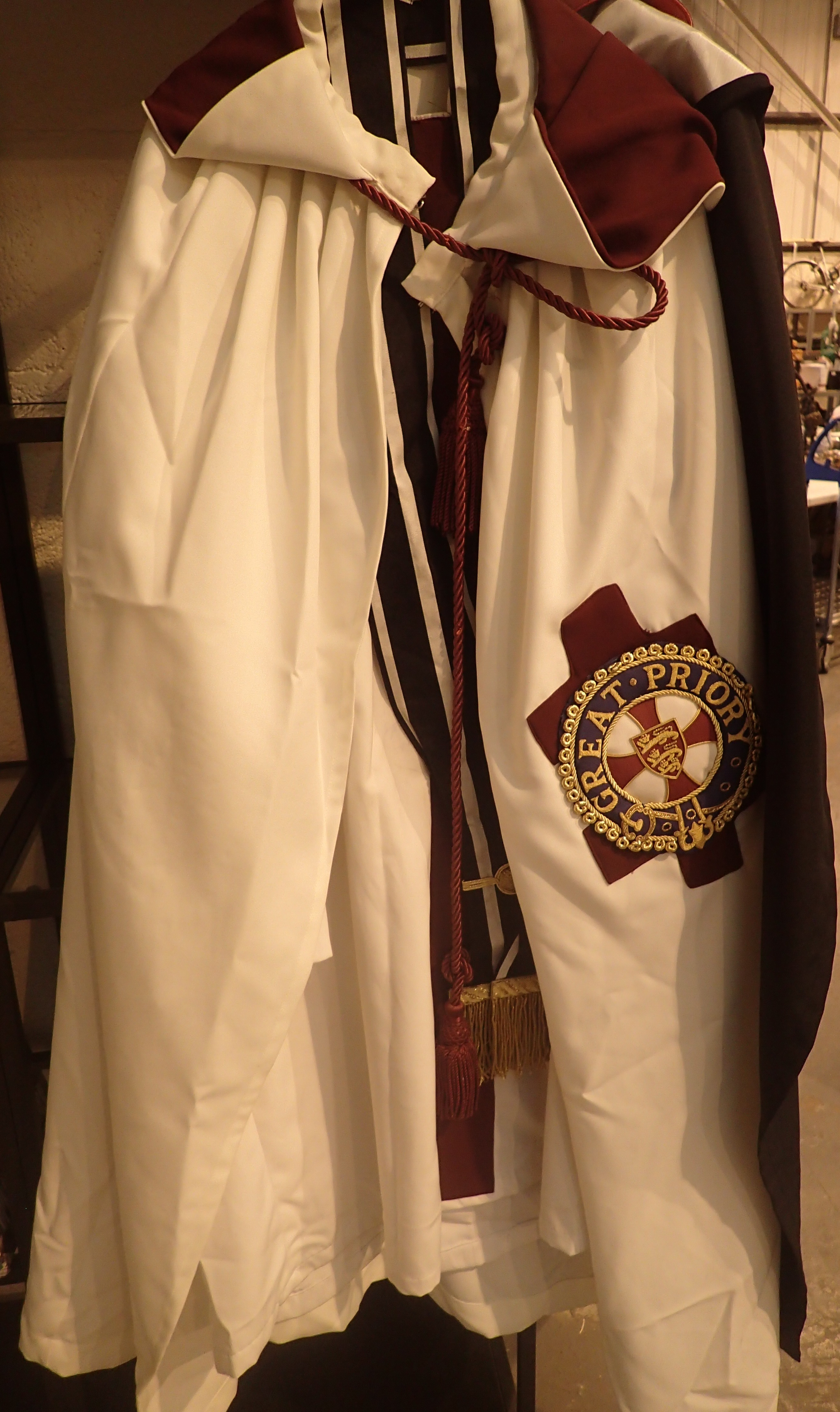 Two sets of Masonic robes capes and jewels one with wire embroidered badge