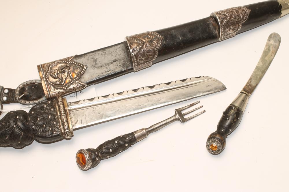 A SCOTTISH DIRK, 19th century, the fullered blade with serrated back ...