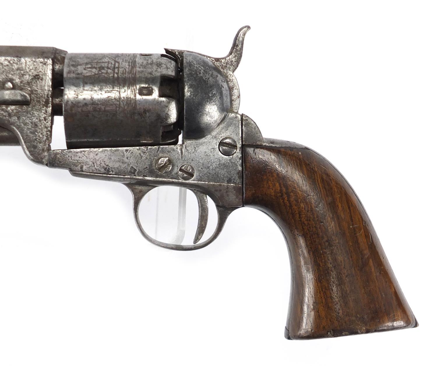 Colt patent revolver with wooden grip, the hexagonal barrel etched with ...