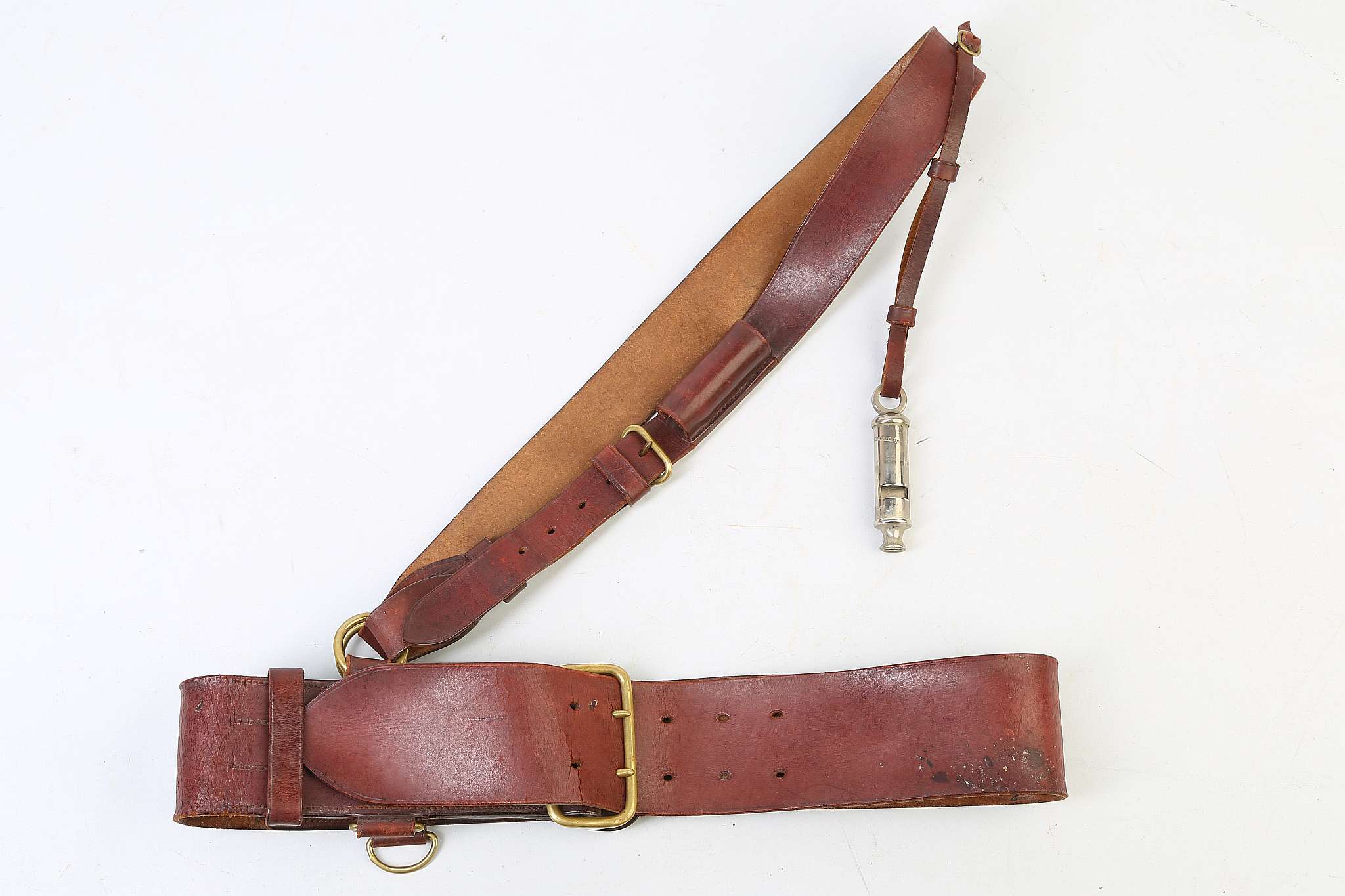 A MID 20th CENTURY LEATHER POLICE BELT AND SASH, with attached 'The ...