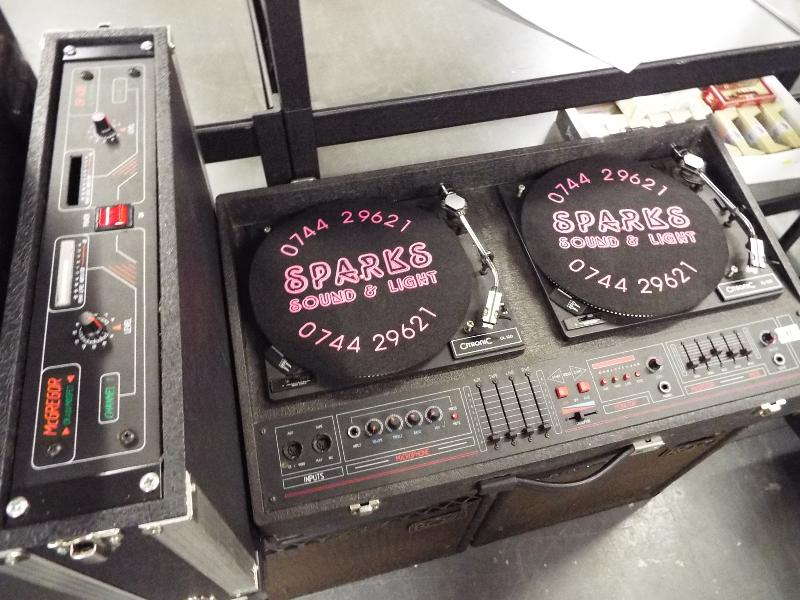 A disco console with twin turntables, Citronic CL12D and a McGregor ...