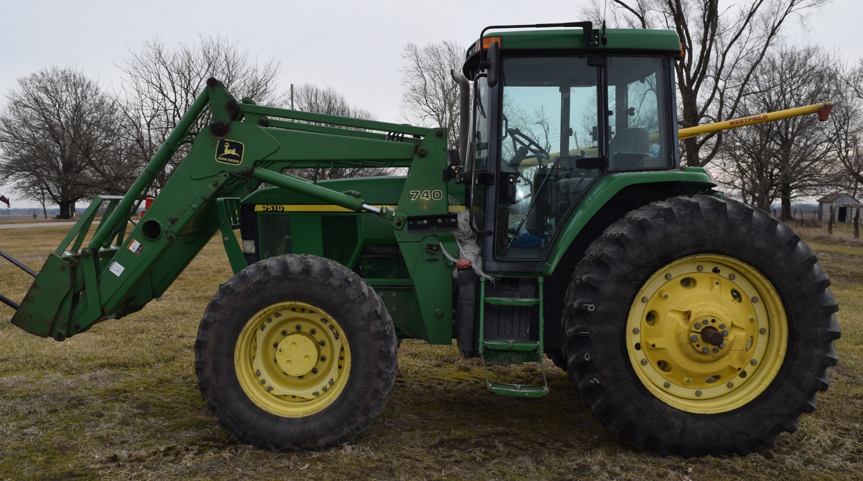 Lot 1003 2001 John Deere 7510 with John Deere 740 self-leveling loader ...