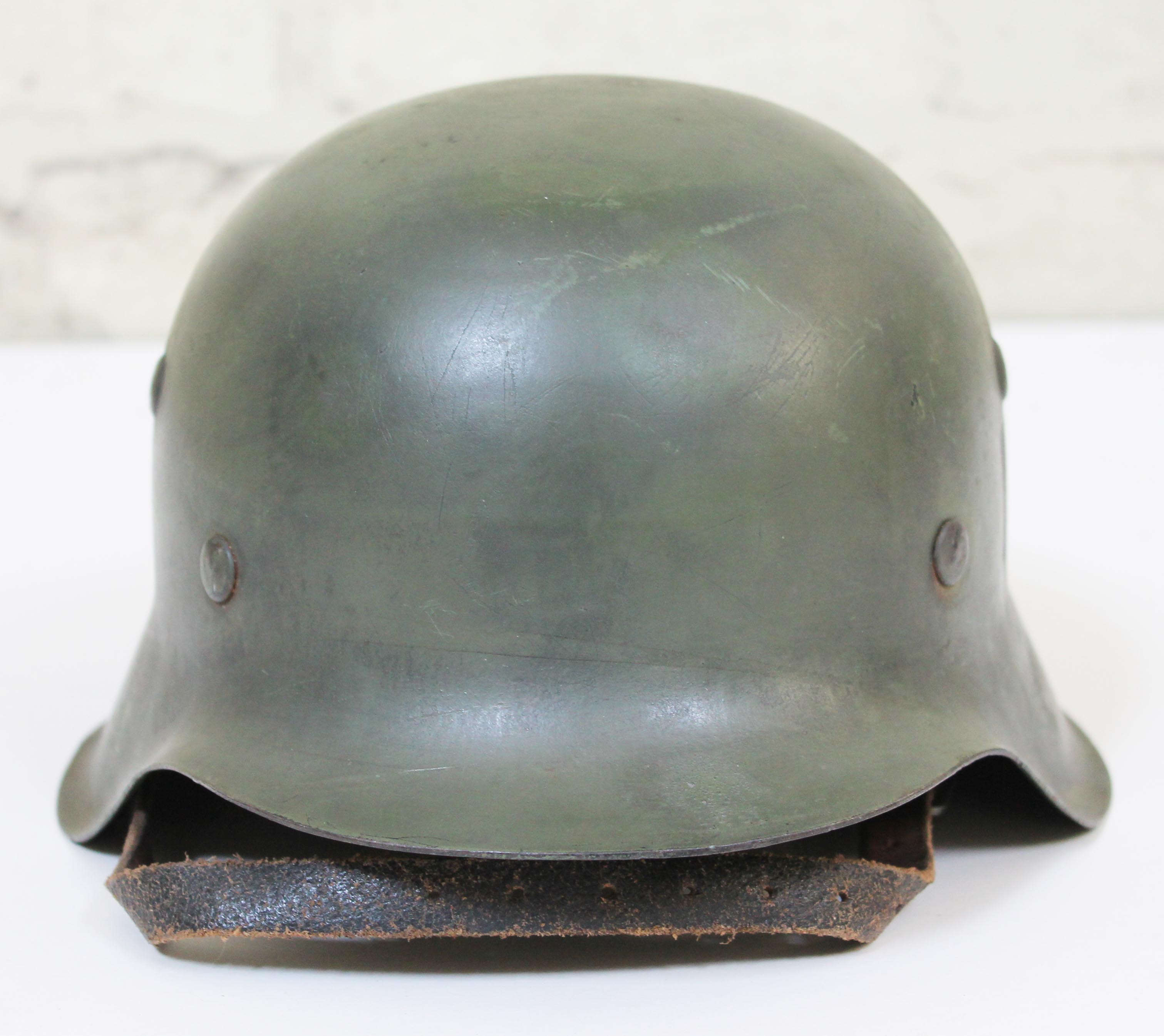 A German WWII military Police helmet with single decal, the inside rim ...