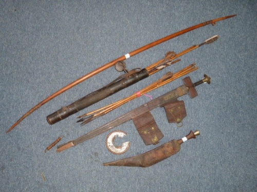 Tribal Weapons; a North African wooden bow and approx. twelve arrows ...