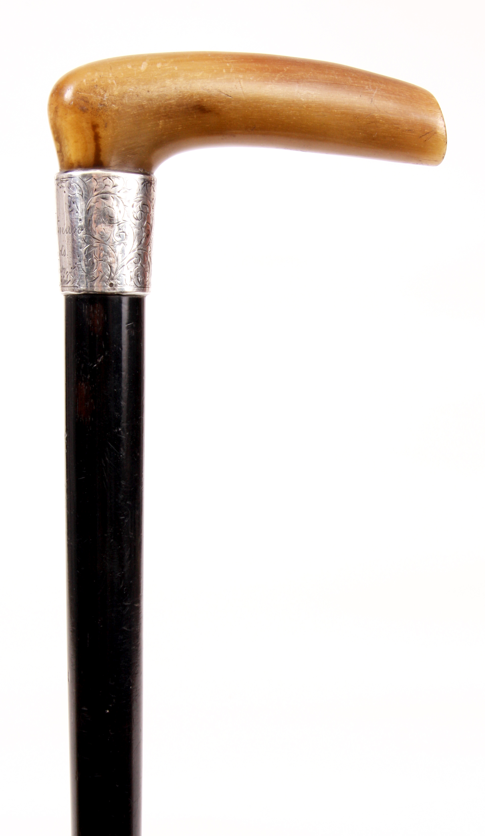 A LATE 19th CENTURY RHINO HORN HANDLED WALKING CANE on ebonized stick ...