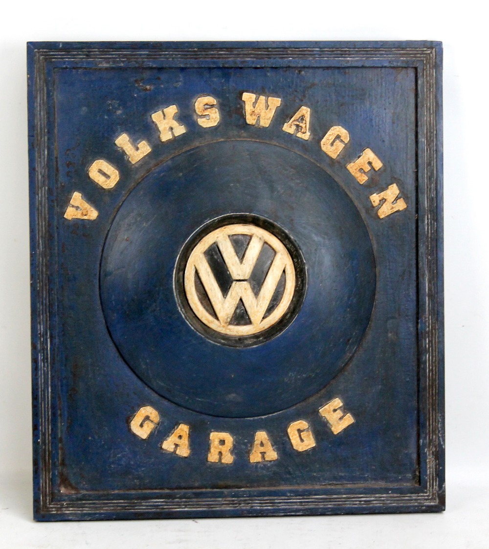 A decorative rectangular sign, inscribed Volkswagen Garage, 47 x 41cm.