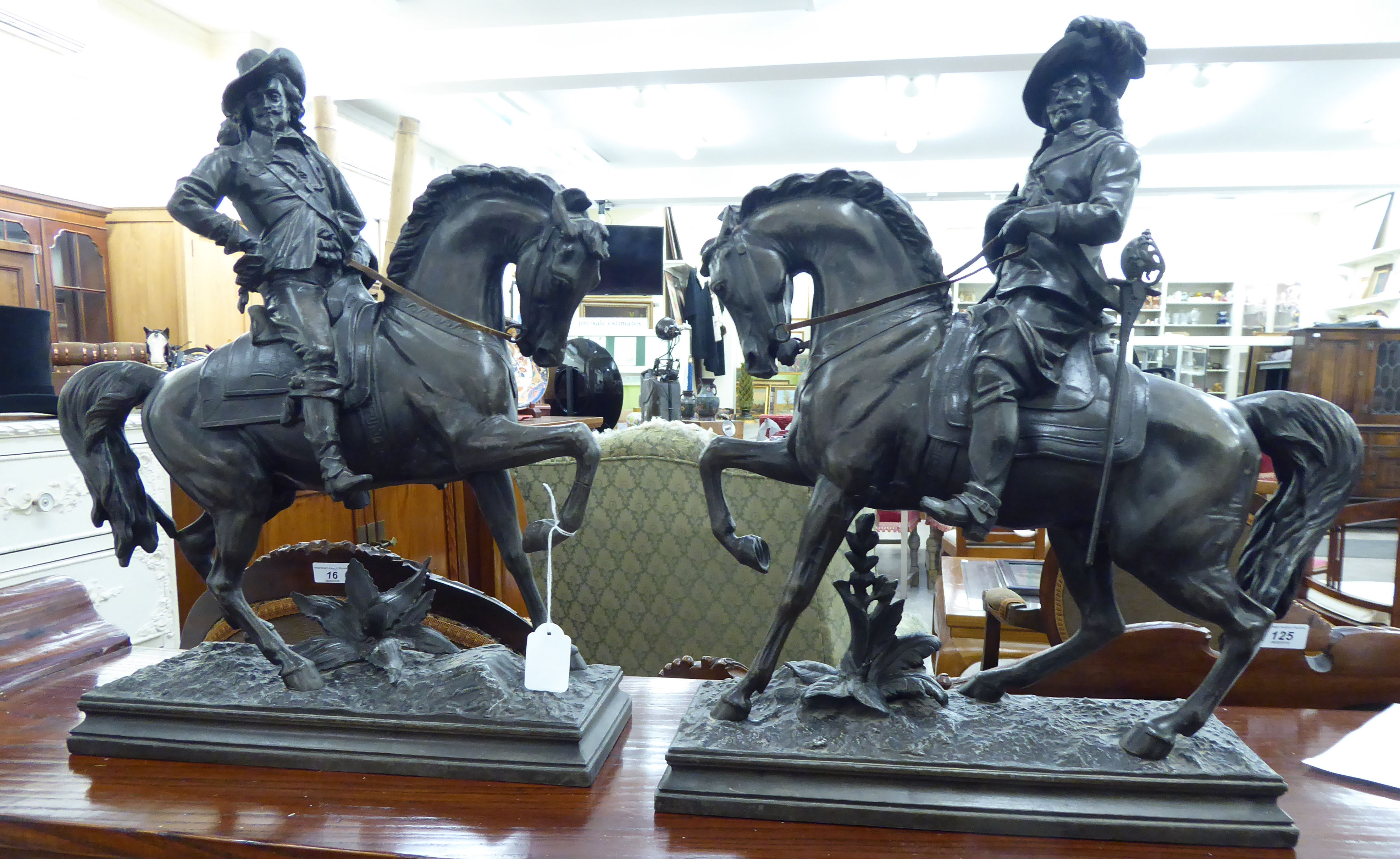 A pair of late 19th/early 20thC cast spelter figures, Cavaliers on ...