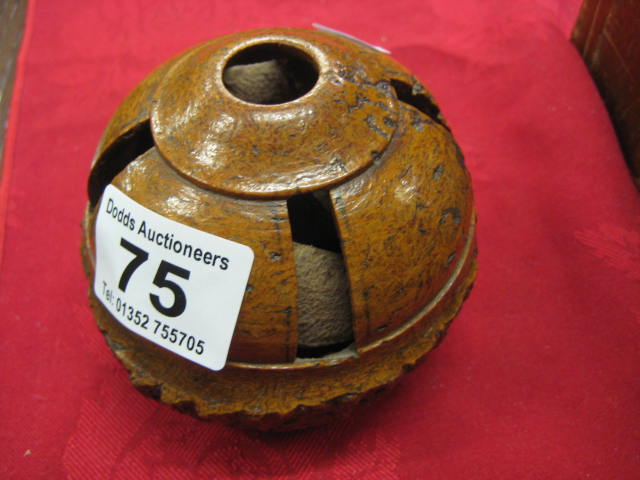 A CARVED BRAZIL NUT POD