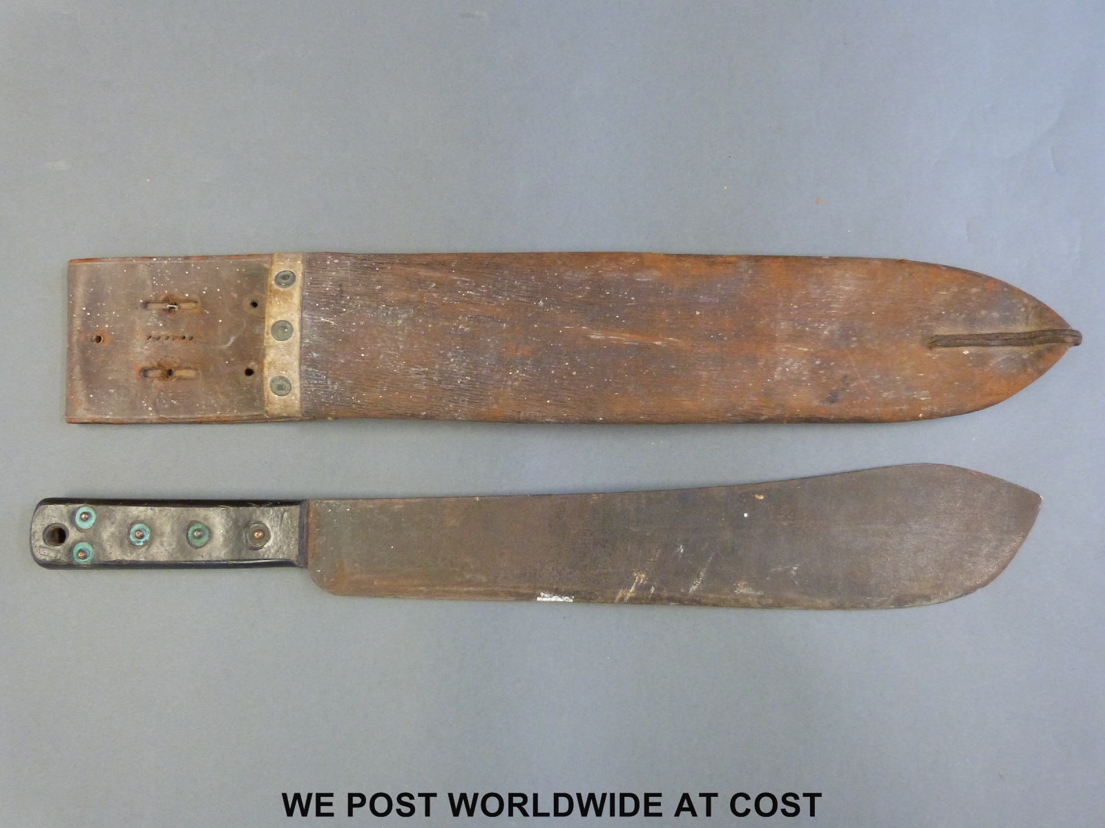 A WWII machete stamped JJB 1944 and with broad arrow above, in leather ...