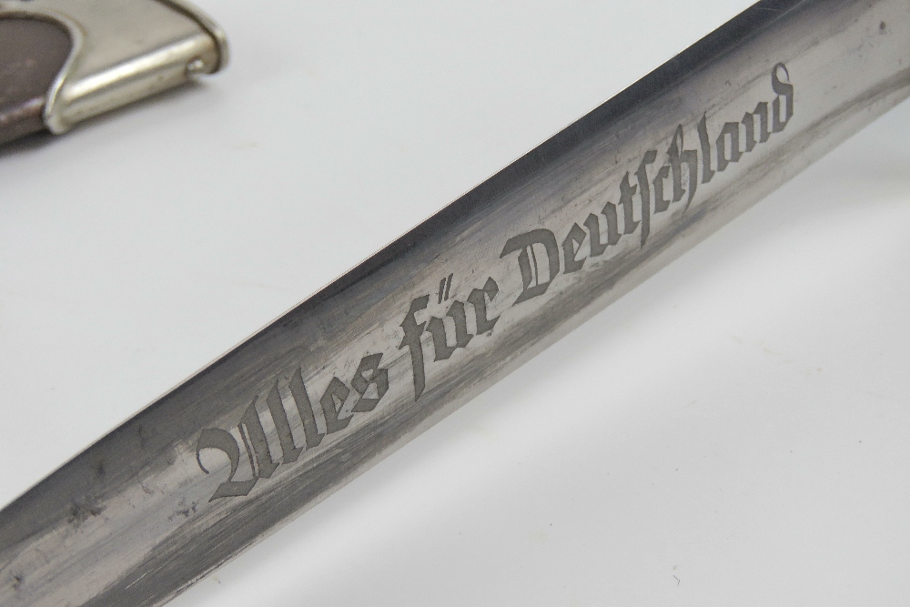 A WWII German SA dagger with full Rhom inscribed blade, having makers ...
