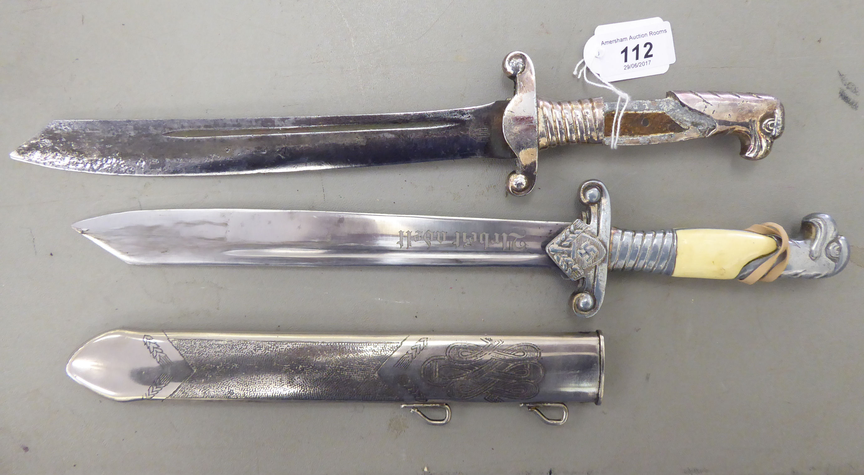 Two reproduction World War II German daggers, viz. an RAD dagger and ...