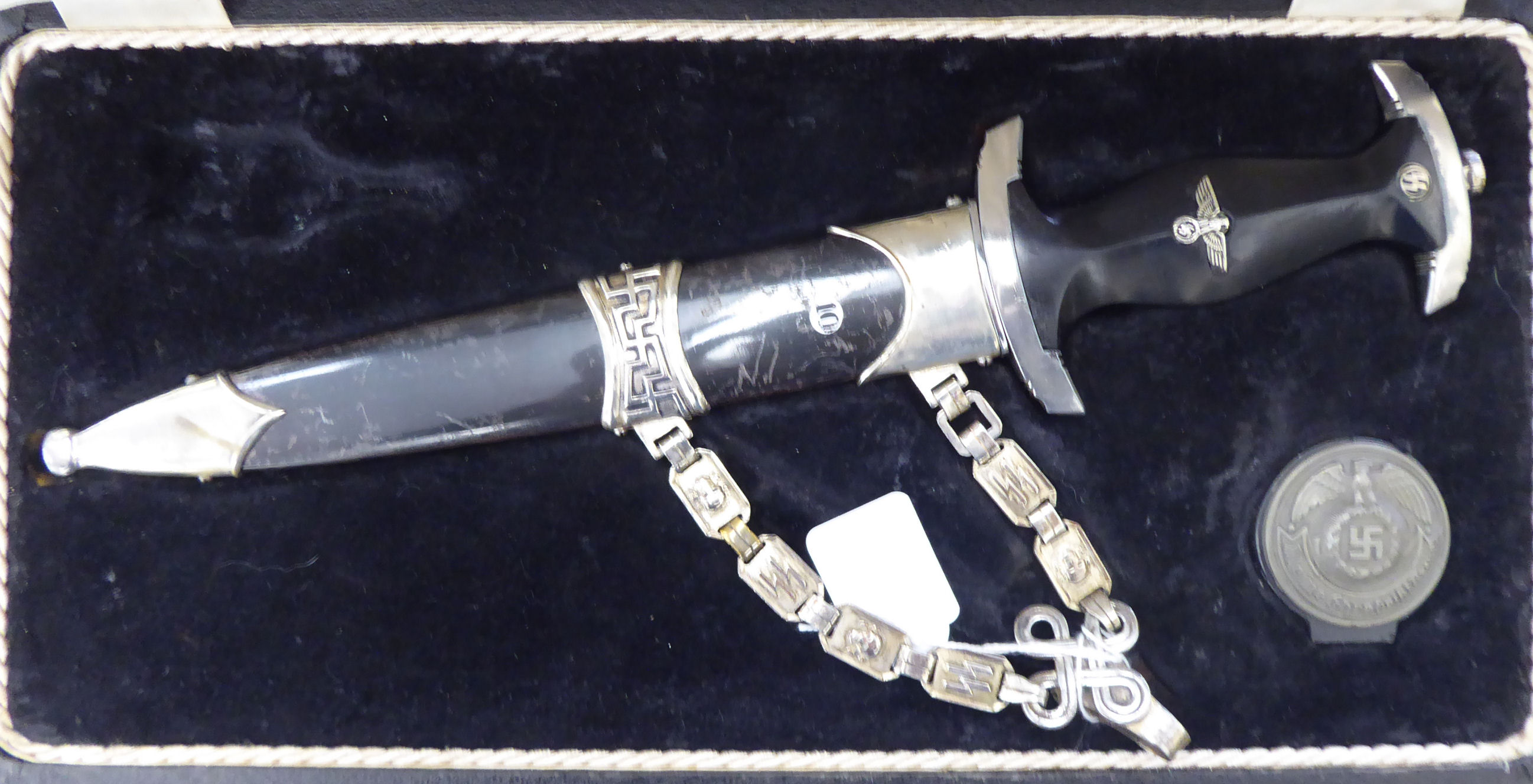 A reproduction of a World War II German SS dagger with a cast metal ...