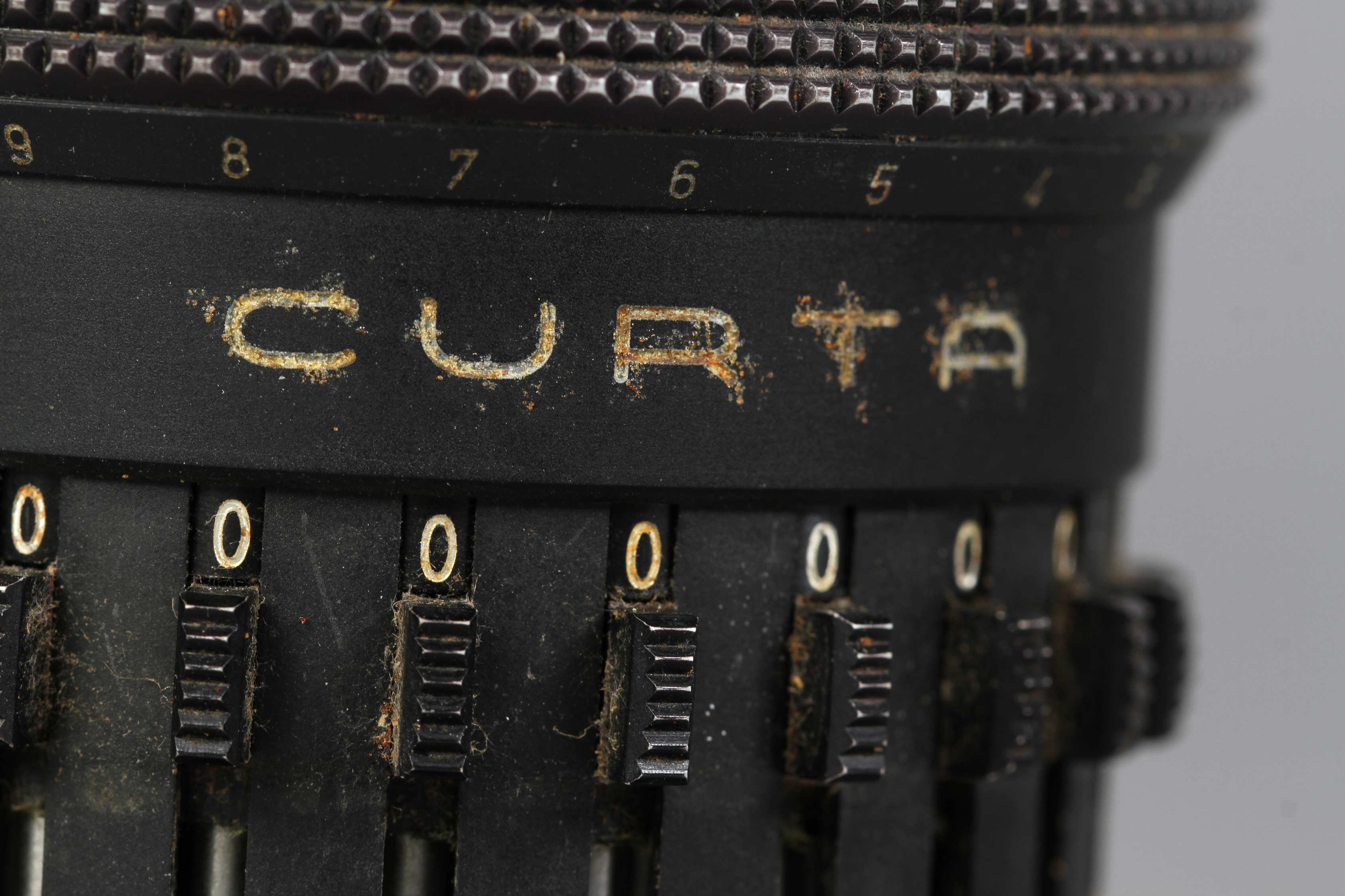 A CURTA CALCULATOR TYPE II, serial no. 506818, having a black body, 6 ...